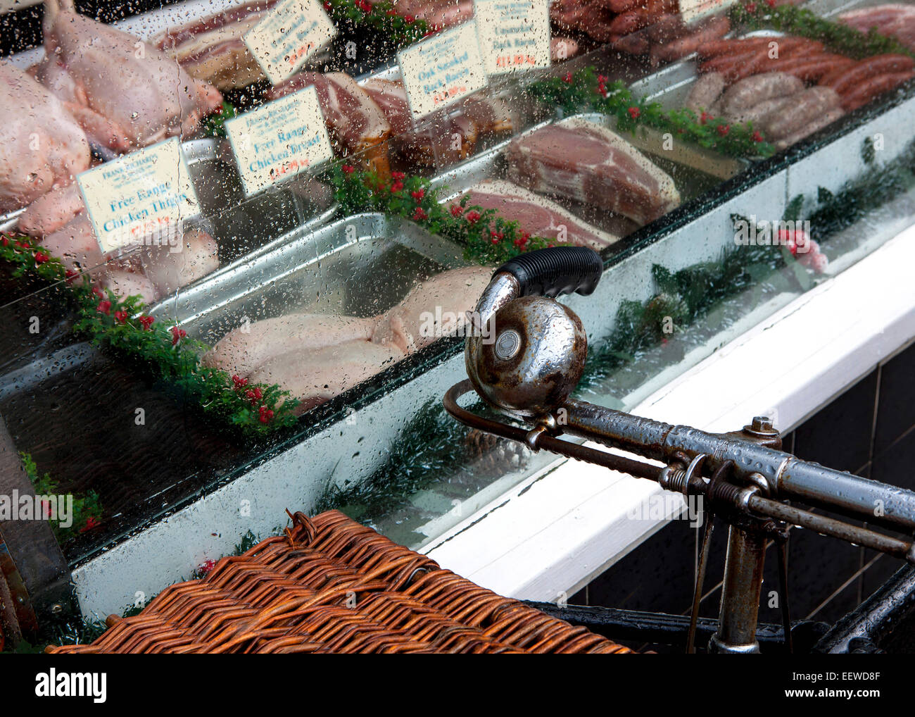 Butchers bike outside butchers shop in rain Stock Photo - Alamy