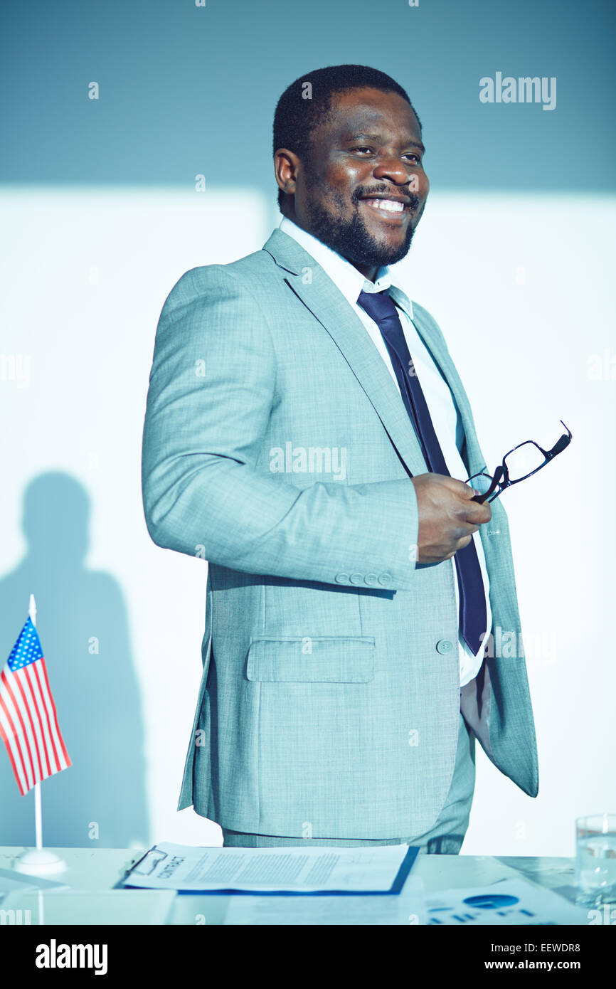 Happy African-american employee in elegant suit Stock Photo - Alamy