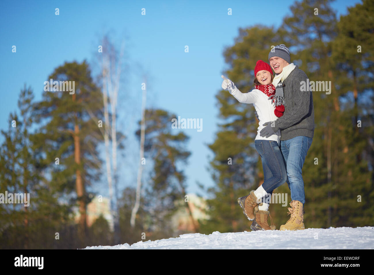 Ecstatic young couple in winterwear spending leisure in park Stock ...