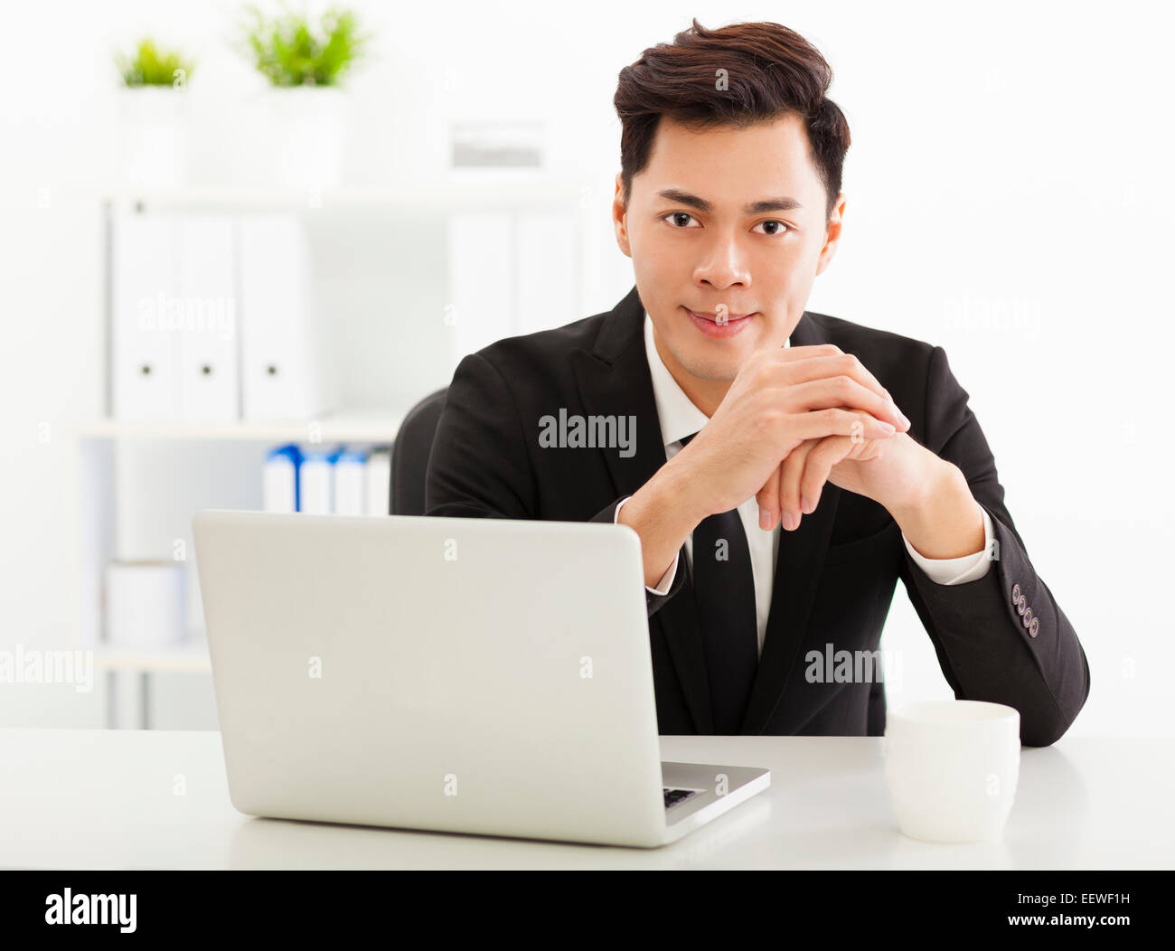 Young business man working in the office Stock Photo - Alamy