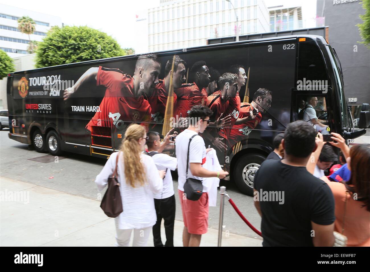 Wayne Rooney signs autographs for fans as he returns to the Manchester ...