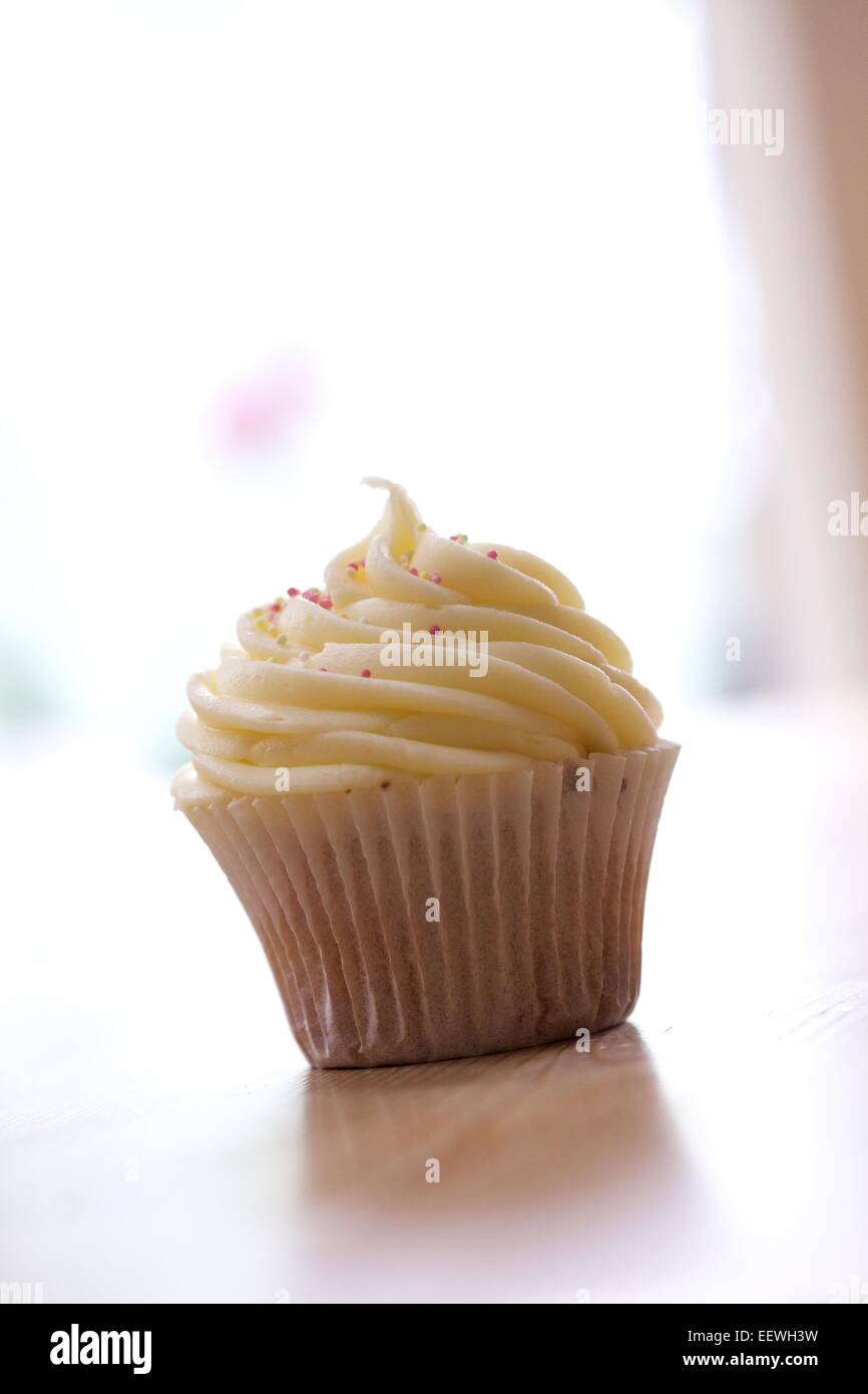 single cup cake on table Stock Photo - Alamy