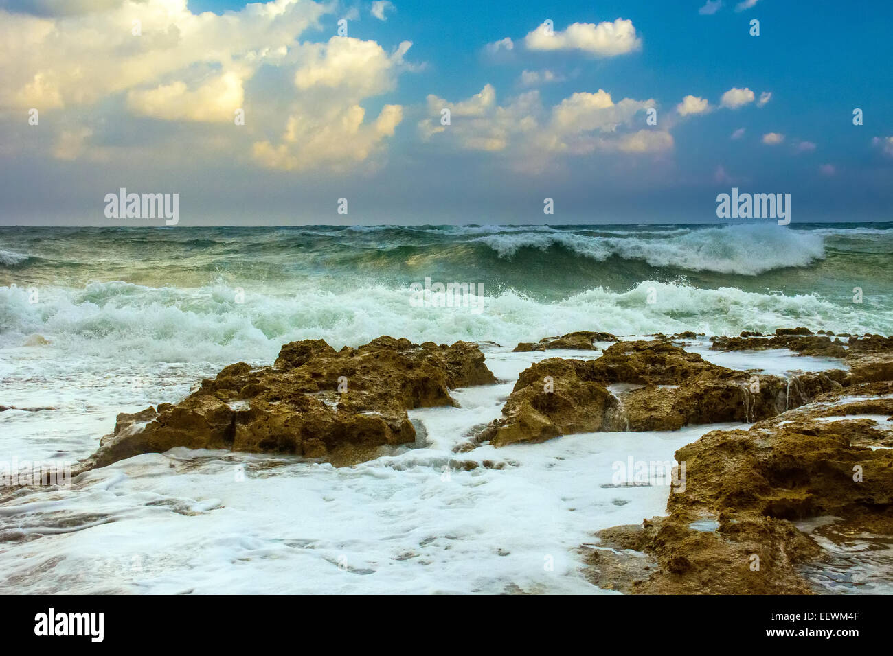 Breaking about rocks Stock Photo - Alamy