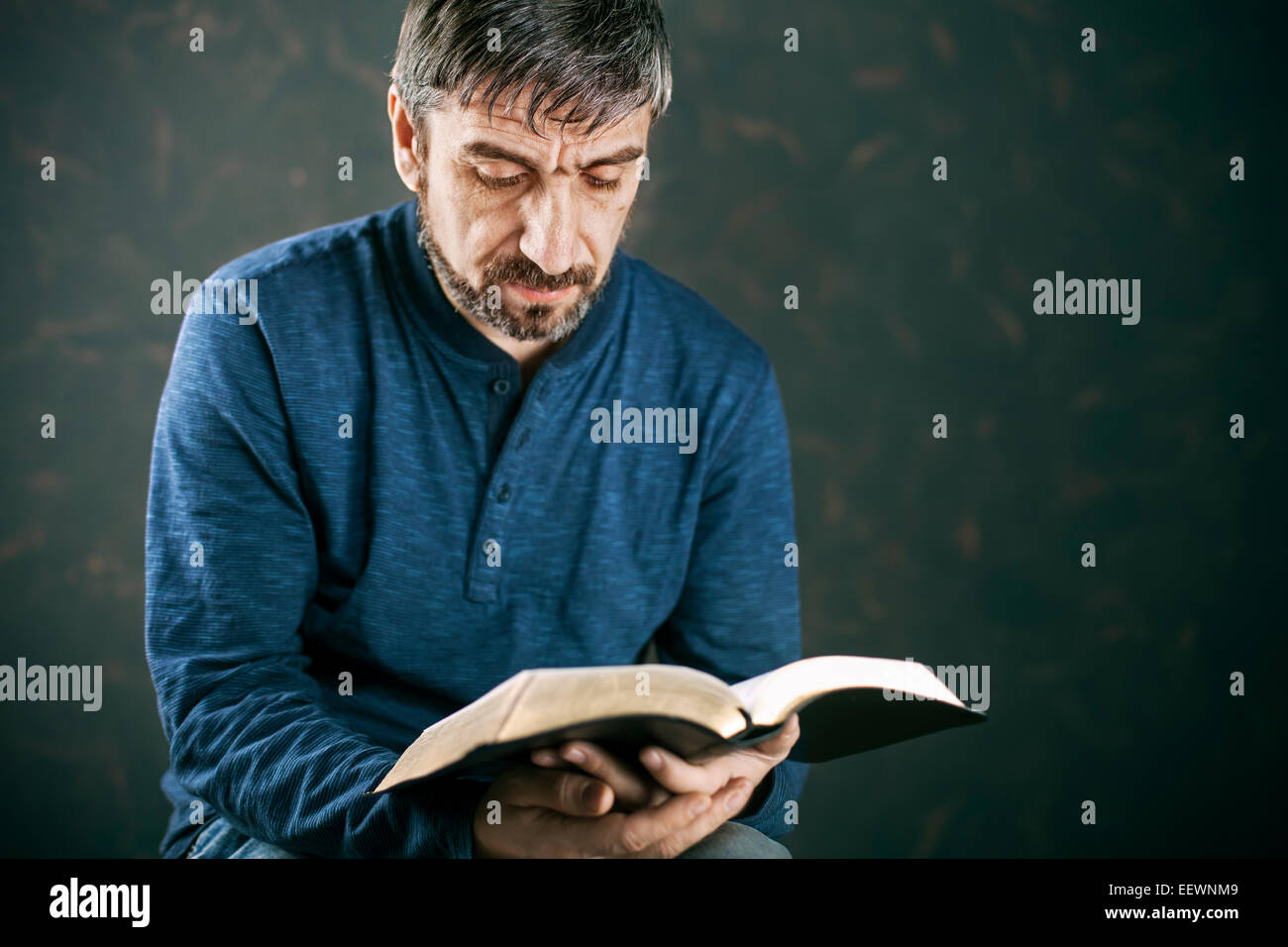 Man reading the holy bible Stock Photo - Alamy