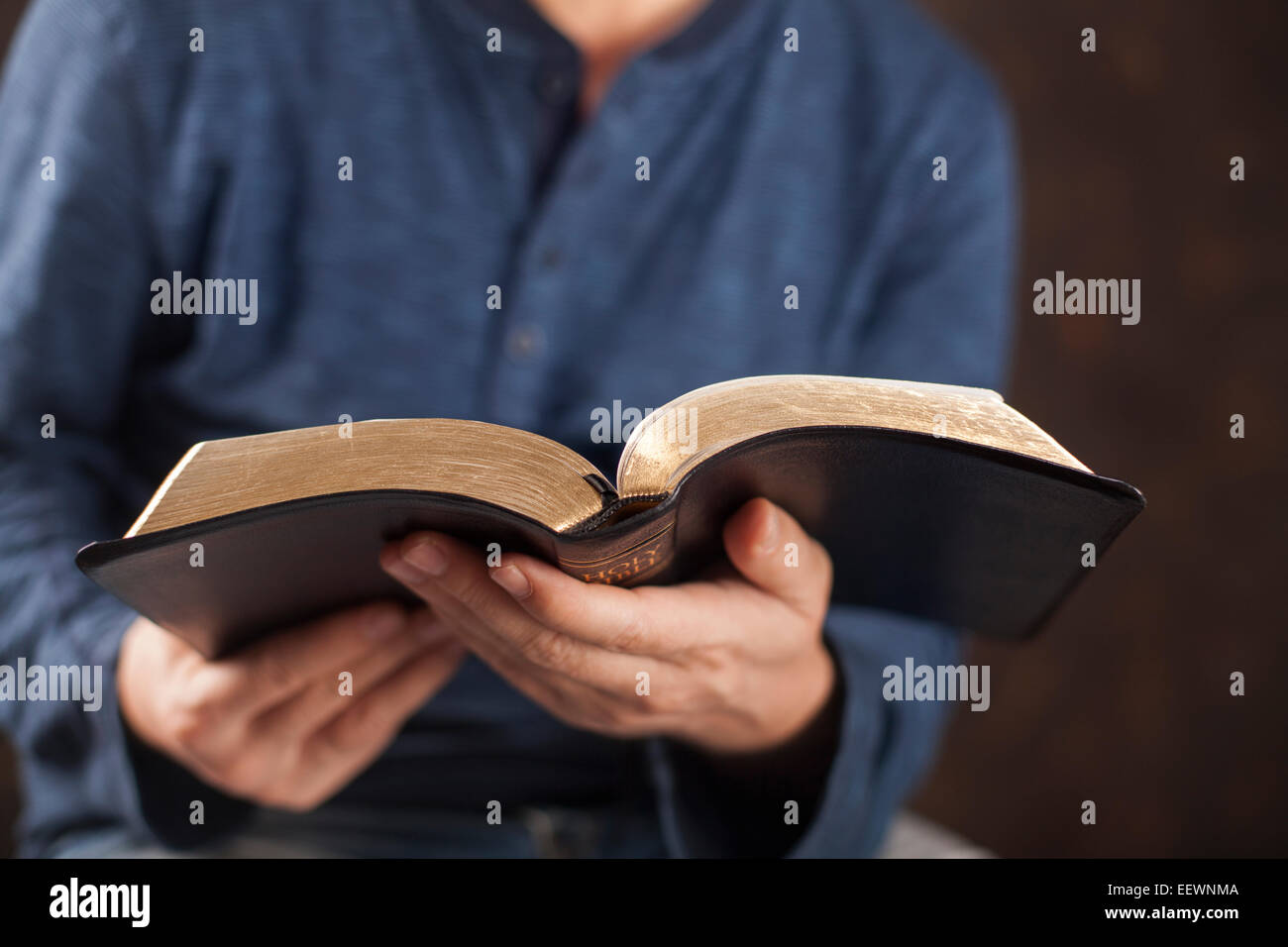 Man reading the holy bible Stock Photo - Alamy