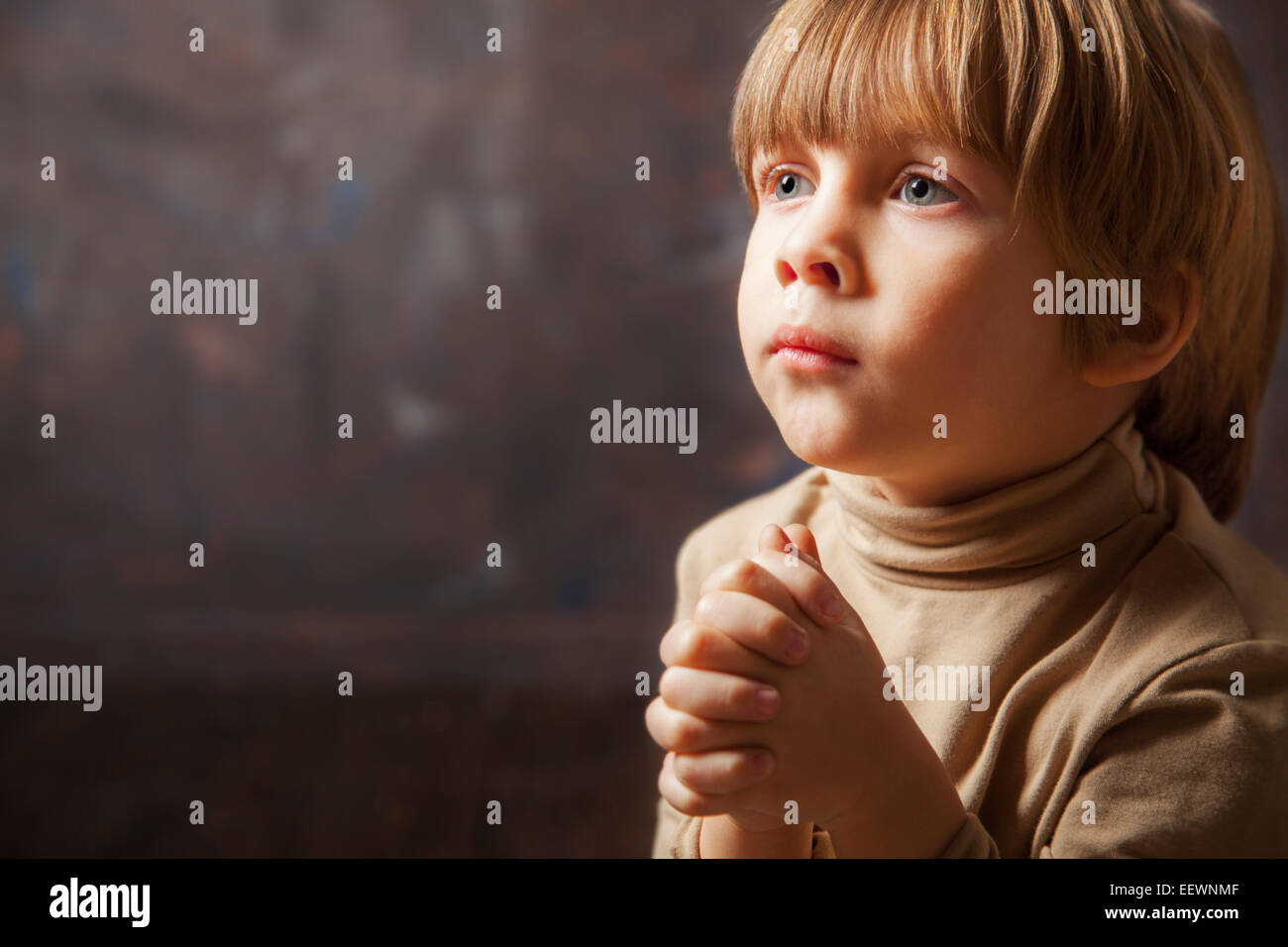Little young beautiful boy spiritual peaceful praying Stock Photo - Alamy