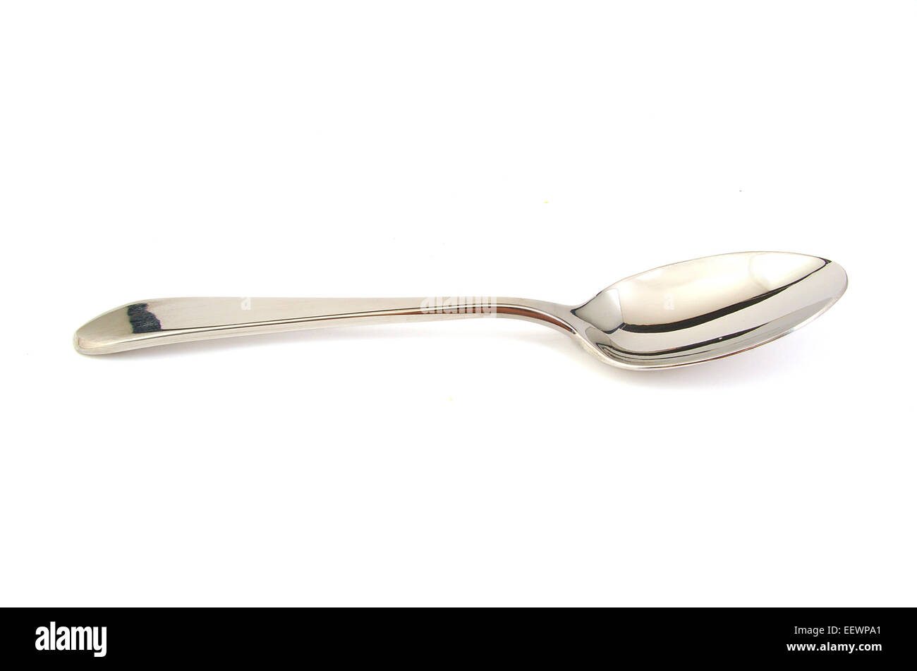 Closeup of metal spoon on white background Stock Photo - Alamy