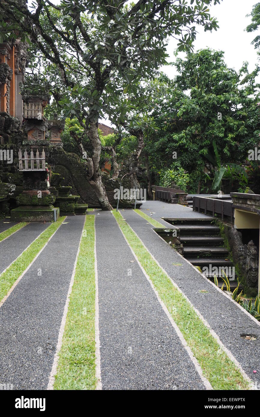 Parallel lines of grass and pavement in front of the kori agung gate at ...