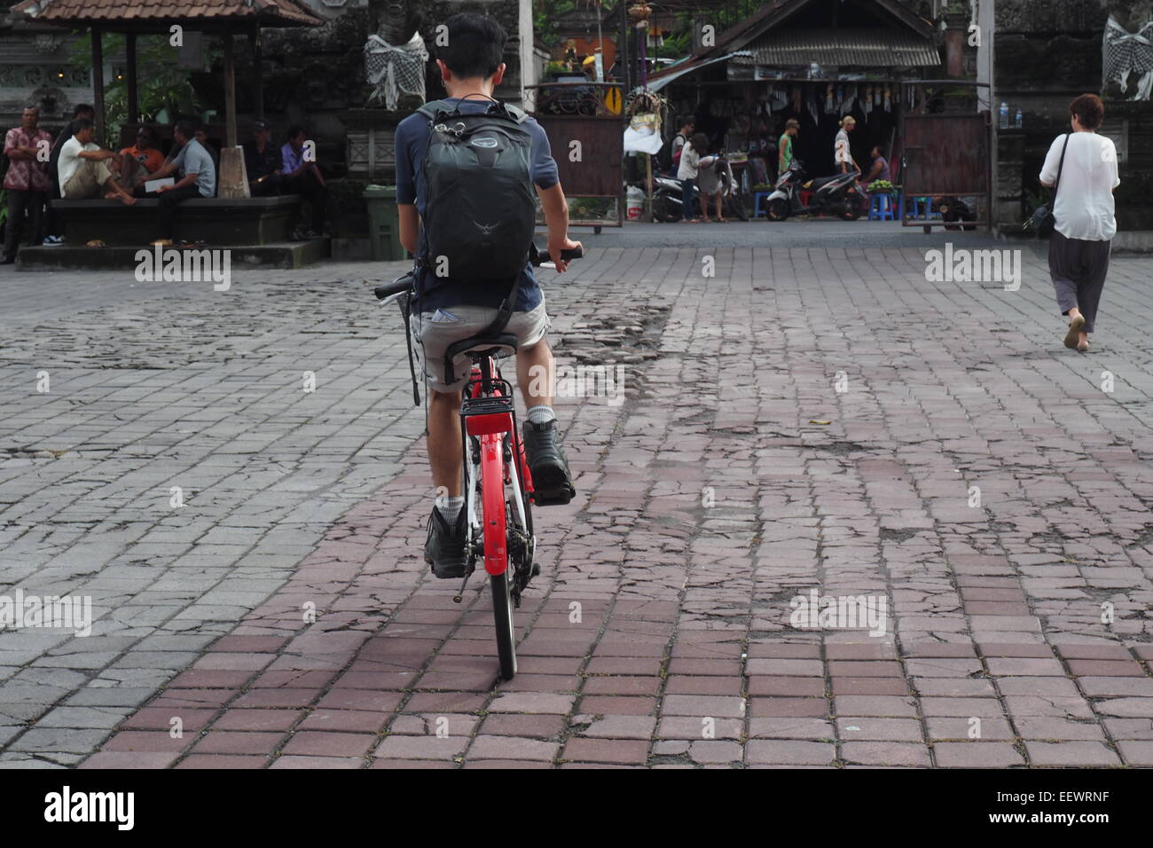 Cyclist riding a red bicycle in Ubud, Bali Stock Photo - Alamy