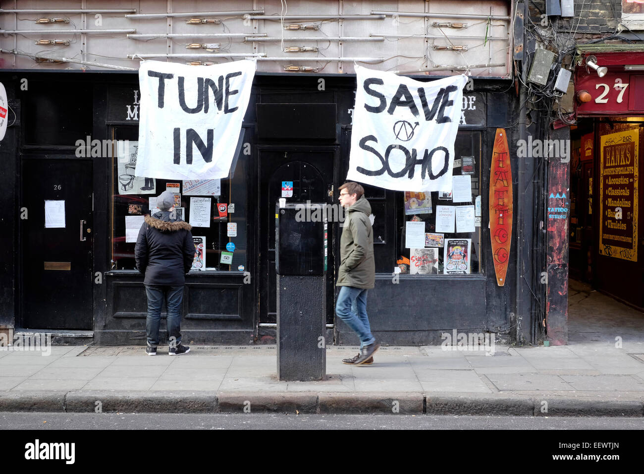 A man walks past a closed down bar club on Denmark Street, London Stock ...