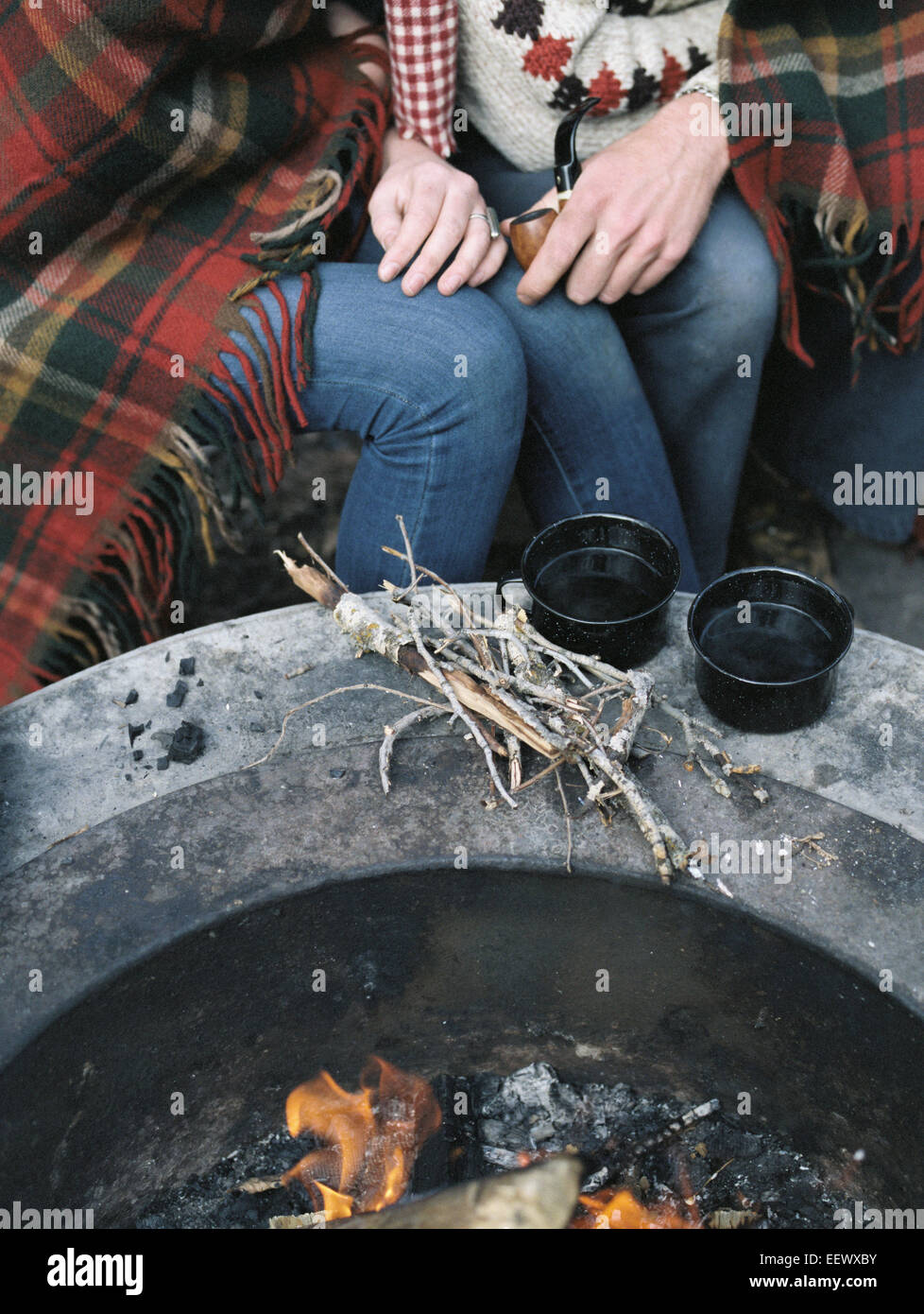 Man sitting fire drink hi-res stock photography and images - Alamy