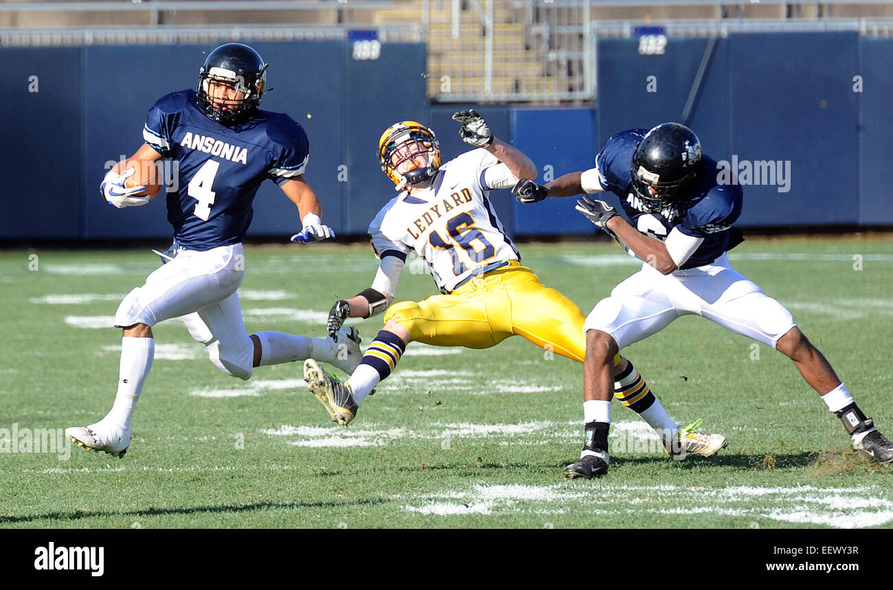 Hartford CT USA-- Ansonia's Andrew Matos looks for room as he gets the ...
