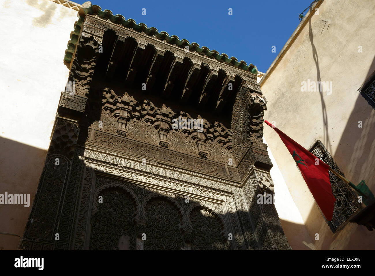 Moroccan flag and elaborate woodcarving, Fez, Morocco Stock Photo - Alamy