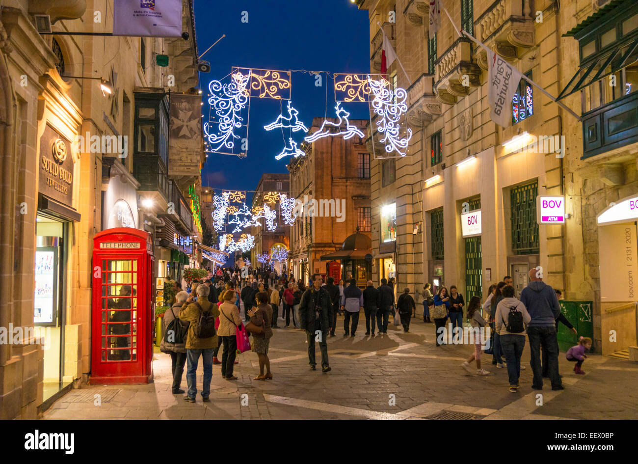 Red Telephone box Christmas decorations and shoppers on Republic Street ...