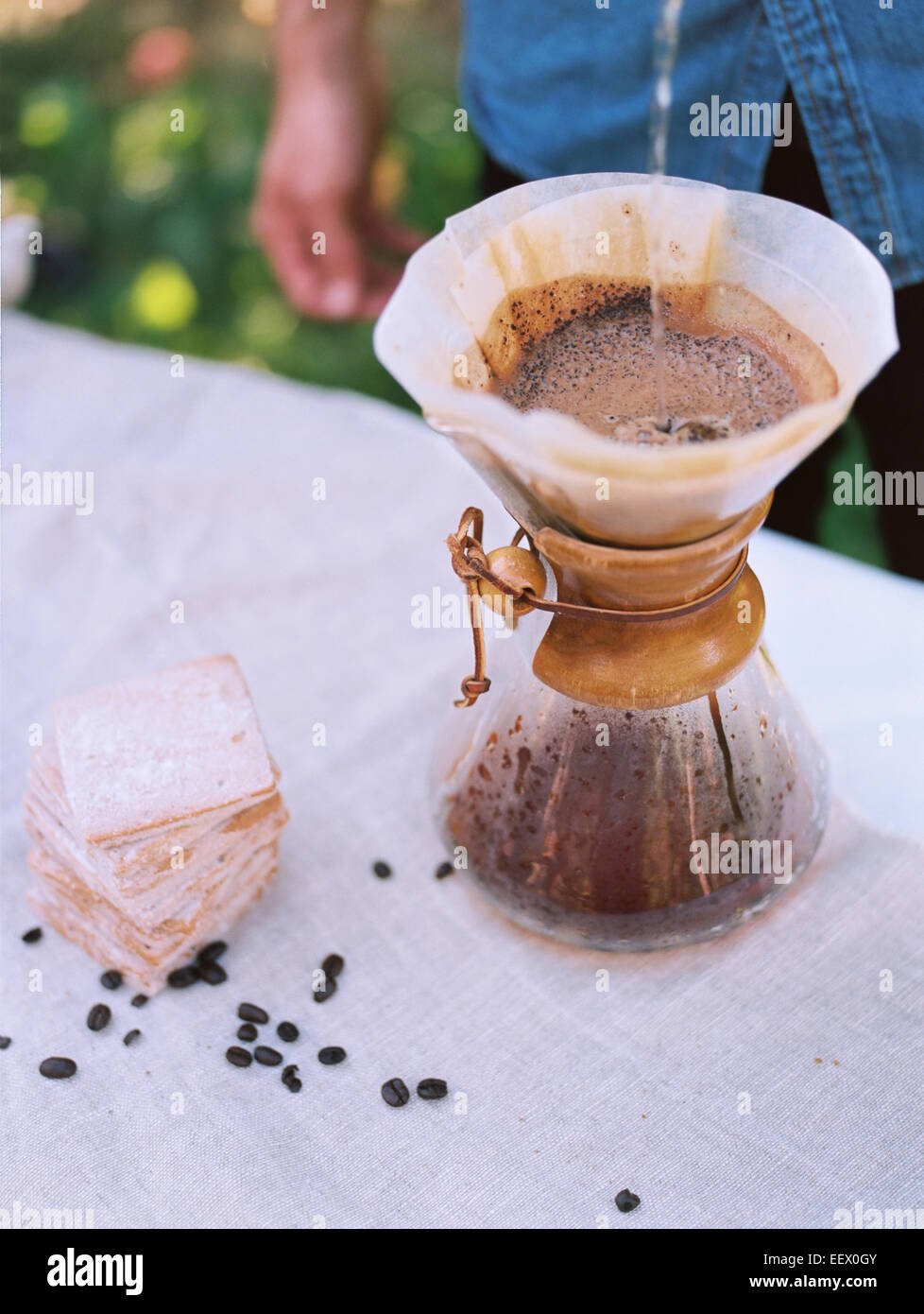 Working at a coffee table hi-res stock photography and images - Alamy