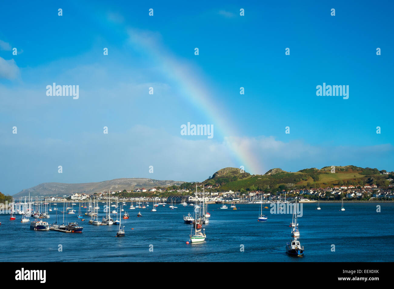 A rainbow over Conwy Bay looking at Deganwy, North Wales, UK Stock ...