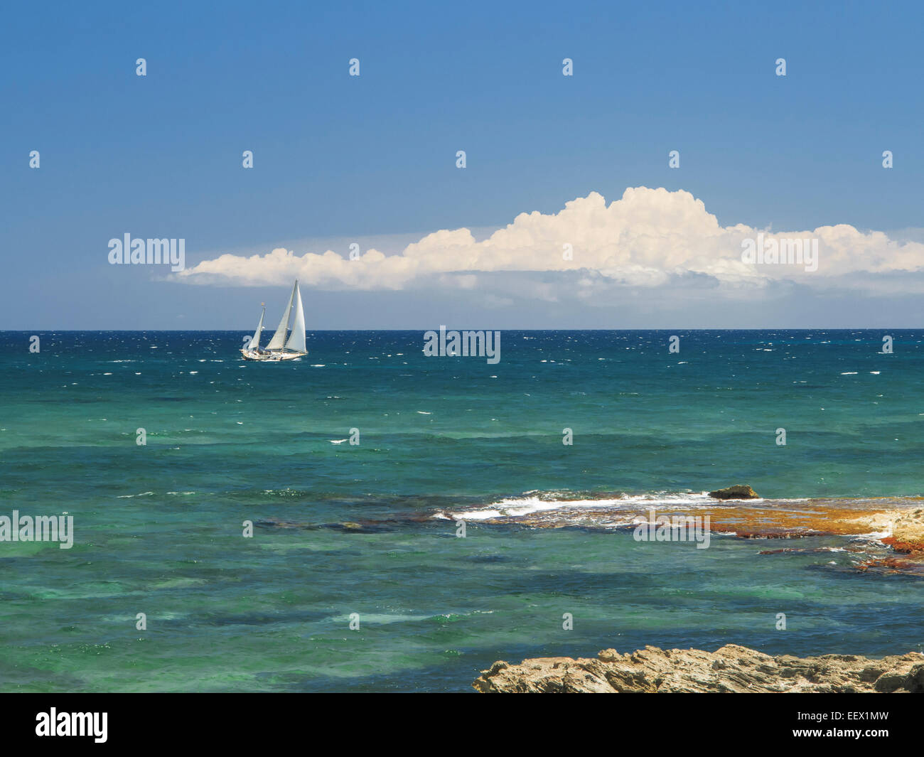 Blue sail yacht on sea hi-res stock photography and images - Alamy