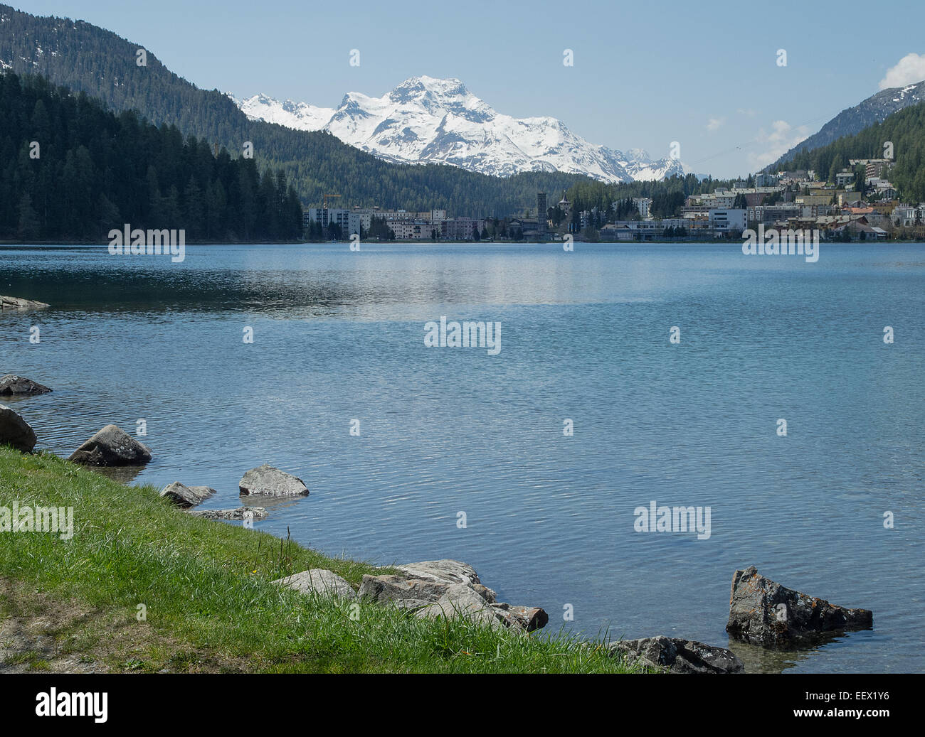 Lake and snow capped mountains in the background with St. Moritz ...