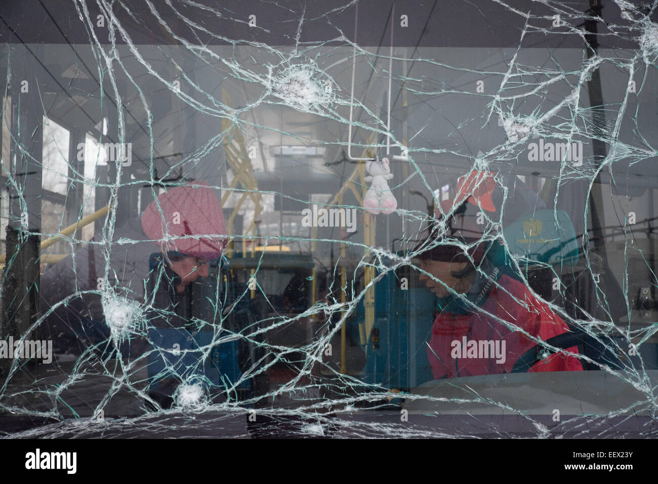 The shrapnel riddled window of a Donetsk city bus that was hit by ...