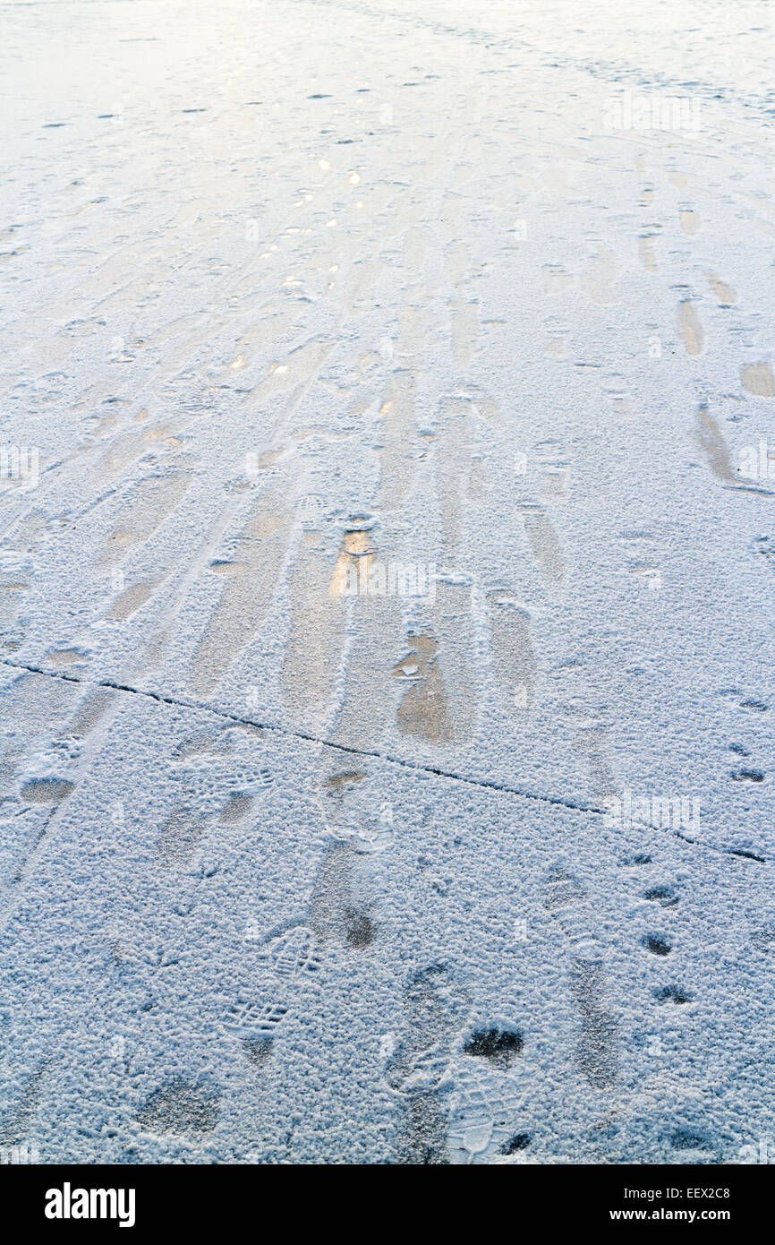 Footprints on the slippery ice Stock Photo - Alamy