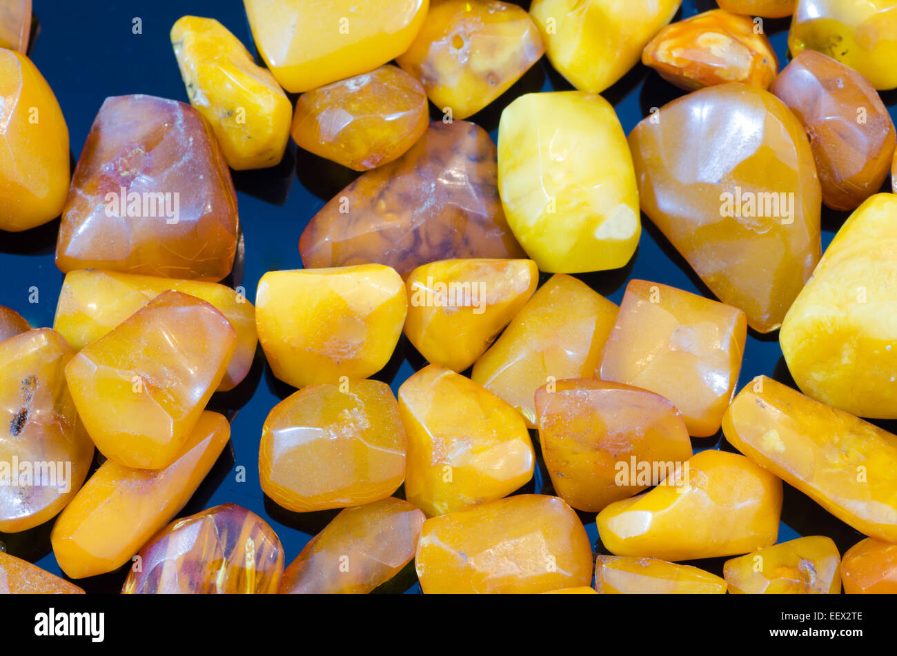 Amber stones dark background closeup hi-res stock photography and ...