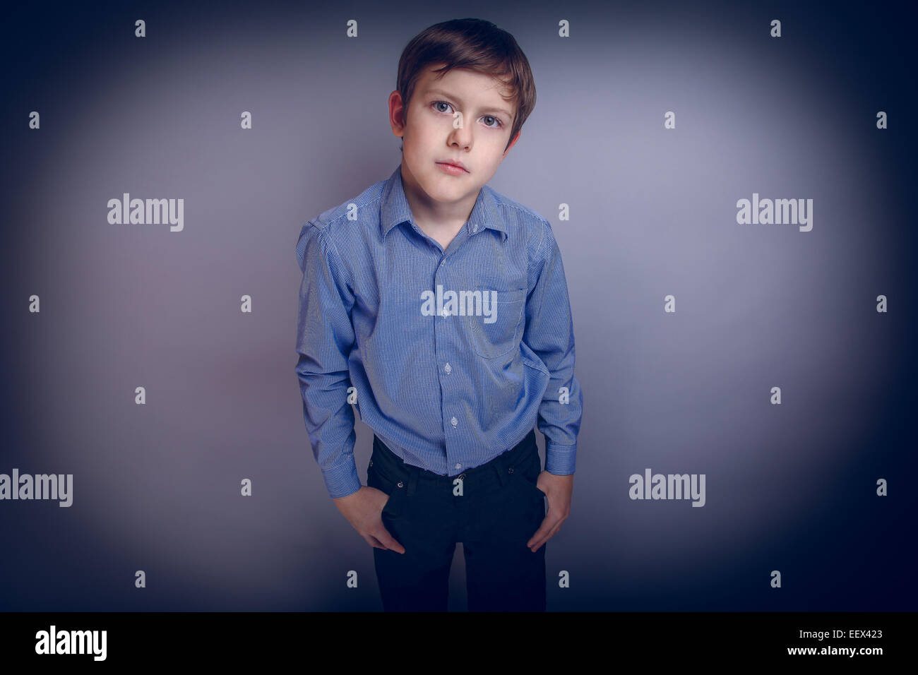 Portrait of a boy adolescence European appearance Brown cross pr Stock ...