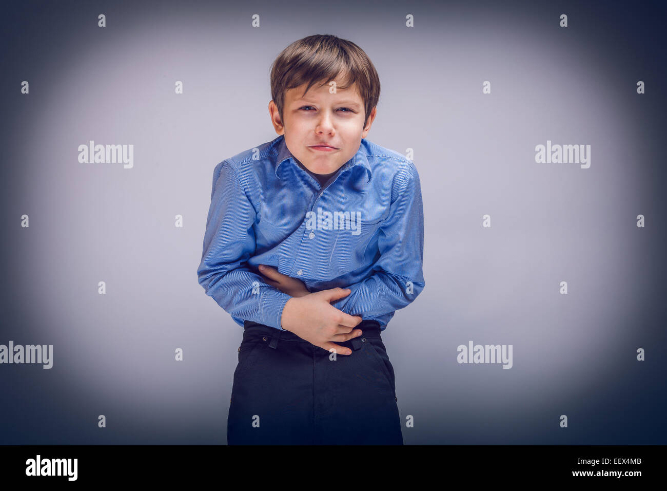 teenager boy of 10 years European appearance stomach ache, ga Stock ...