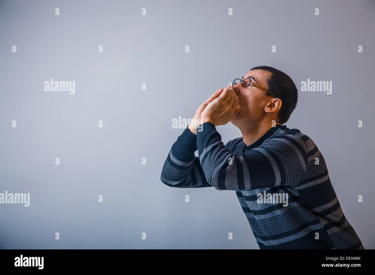 European - looking man of 30 years with glasses, calling, shout Stock ...