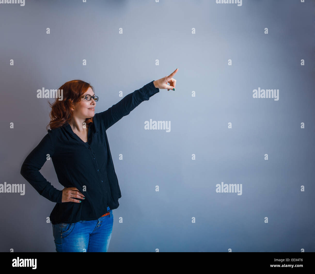European -looking woman of 30 years is pointing in the dire Stock Photo ...