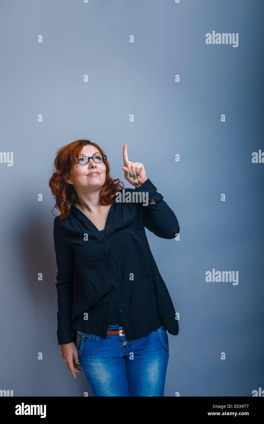 European -looking woman of 30 years is pointing in the direct Stock ...
