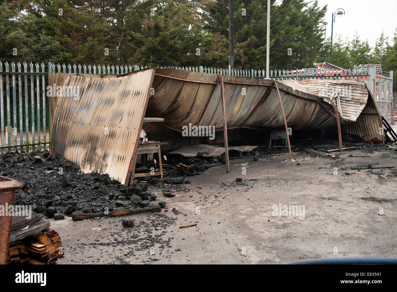 Collapsed corrugated steel heat fire damage burnt Stock Photo - Alamy