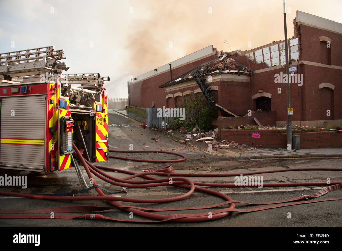 School Gymnasium on Fire Roof collapse big smoke Stock Photo - Alamy