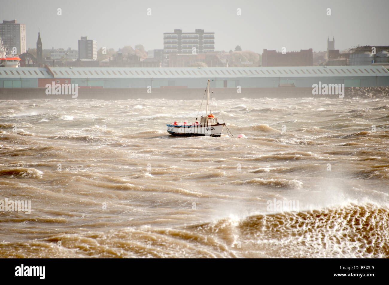Small boat stormy seas windy choppy storm force rough Stock Photo - Alamy