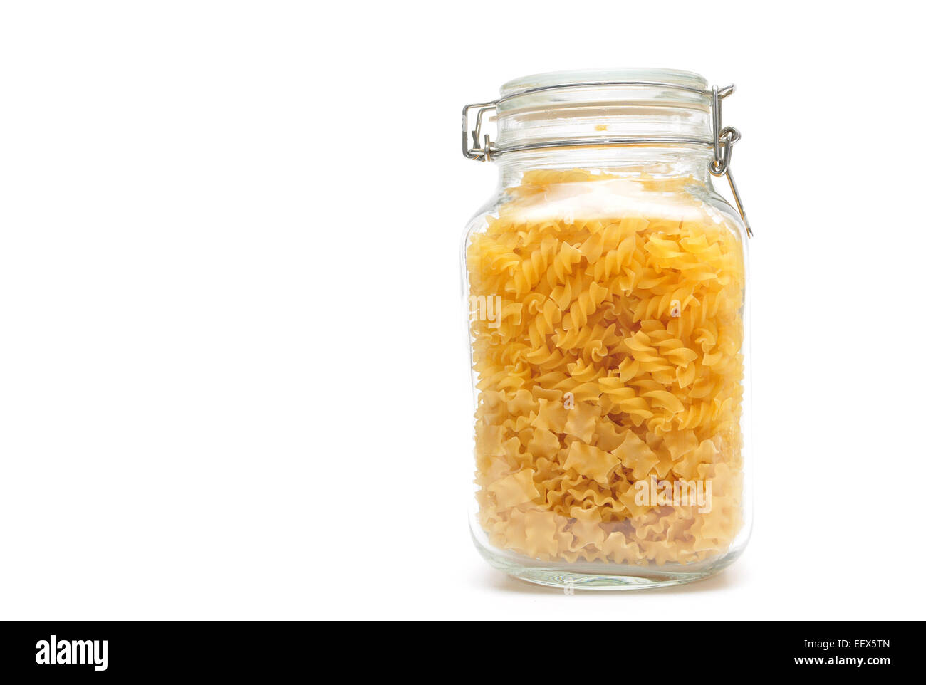 Pasta in glass jar pot isolated on white background Stock Photo - Alamy