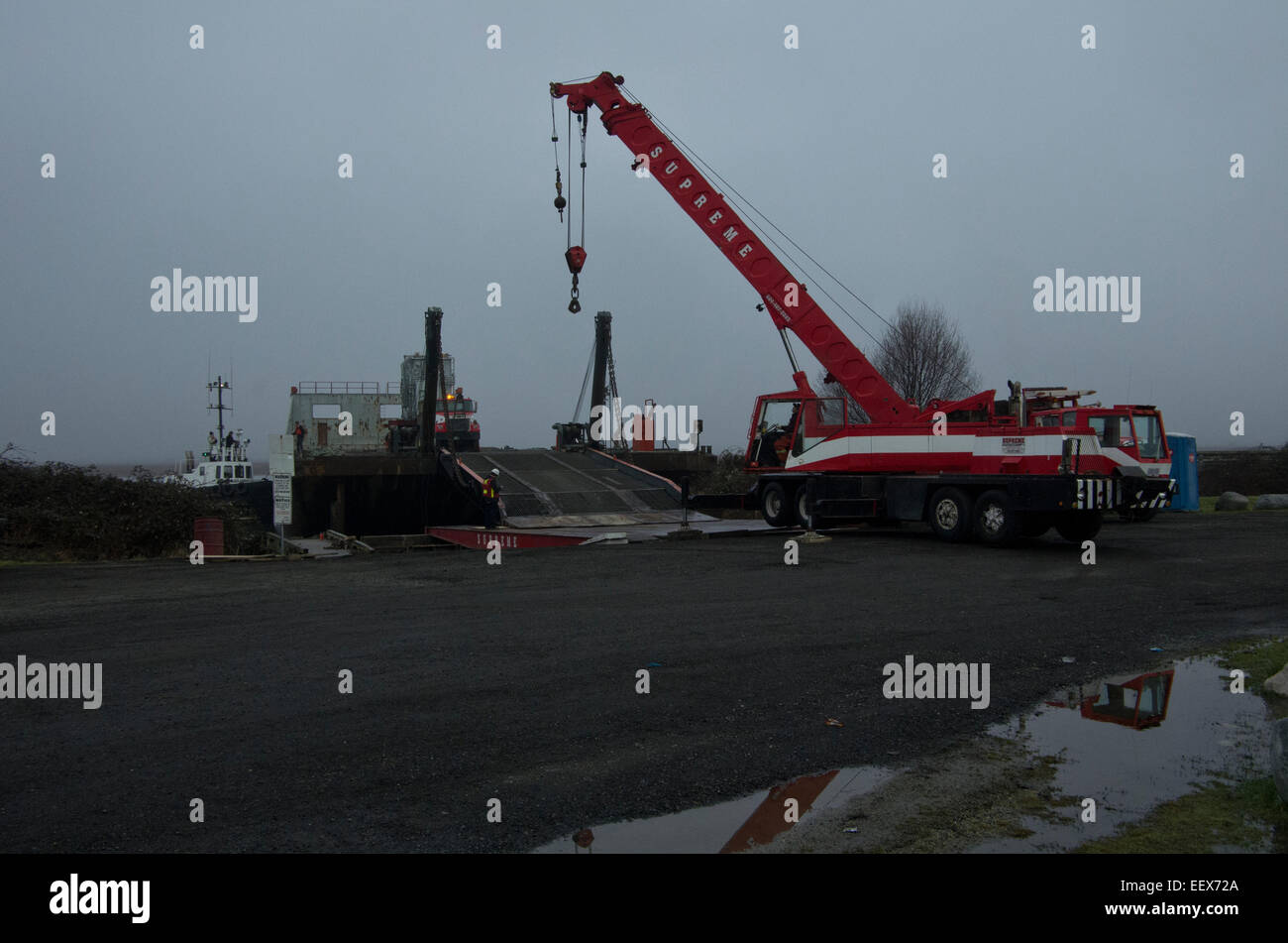 crane preparing to load barge Stock Photo - Alamy