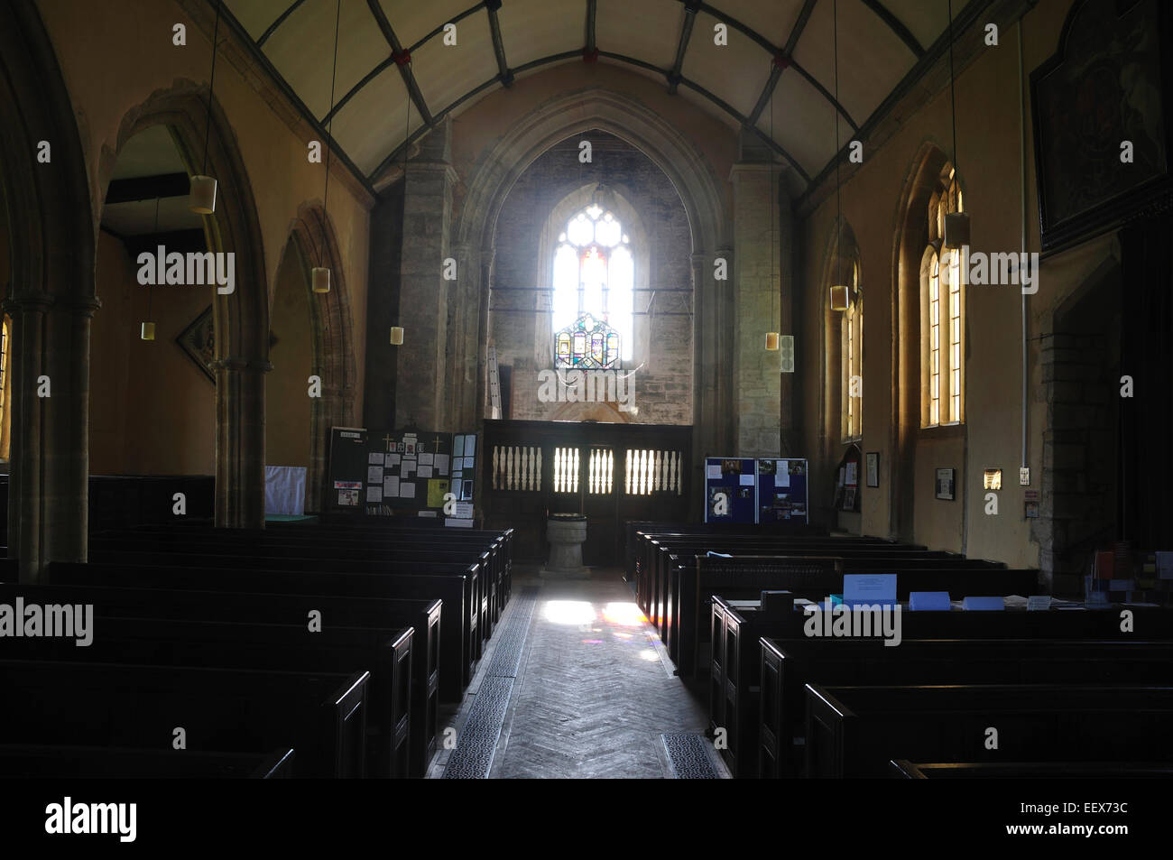 A view of the interior of a church with sun light pouring through the ...