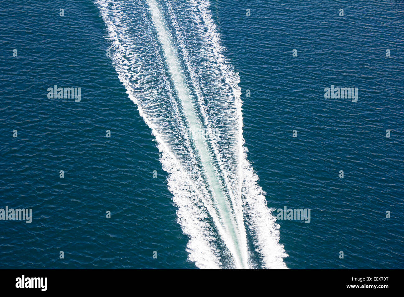 Speed boats trace on the blue sea Stock Photo - Alamy