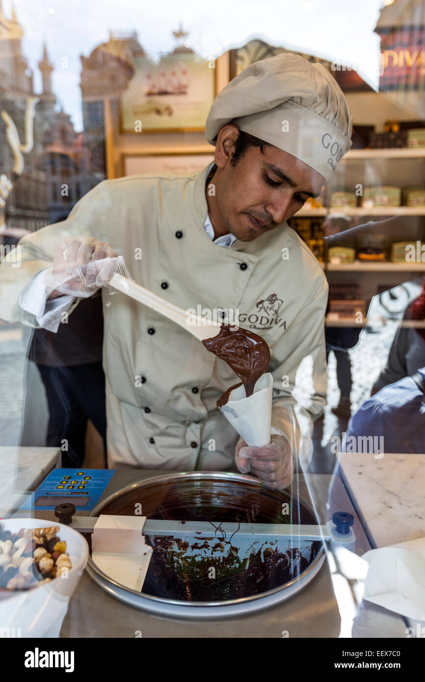 Godiva personal handling chocolate in Grote Markt 21 Stock Photo - Alamy