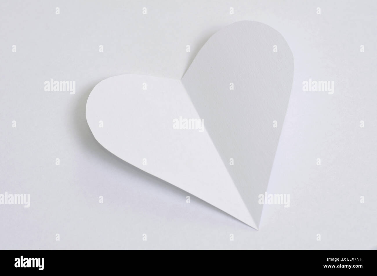 heart cutted from paper lies on the paper background Stock Photo - Alamy