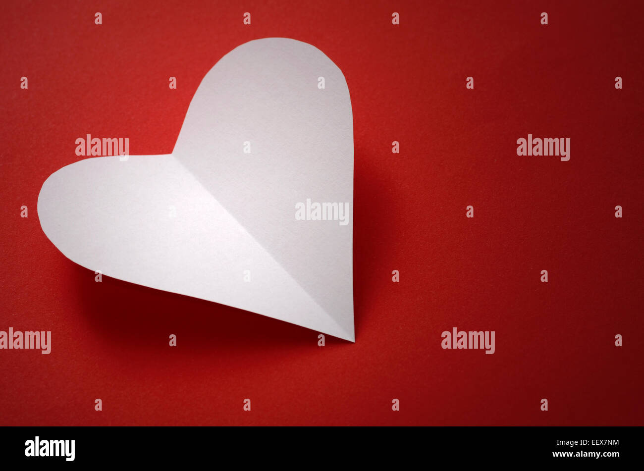 heart cutted from paper lies on the paper background Stock Photo - Alamy