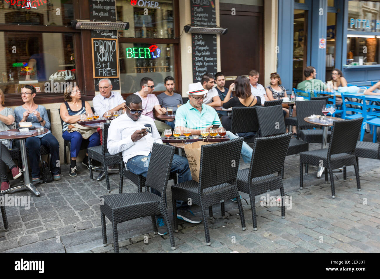 Tourists drinking Belgium beers in a terrace Stock Photo - Alamy