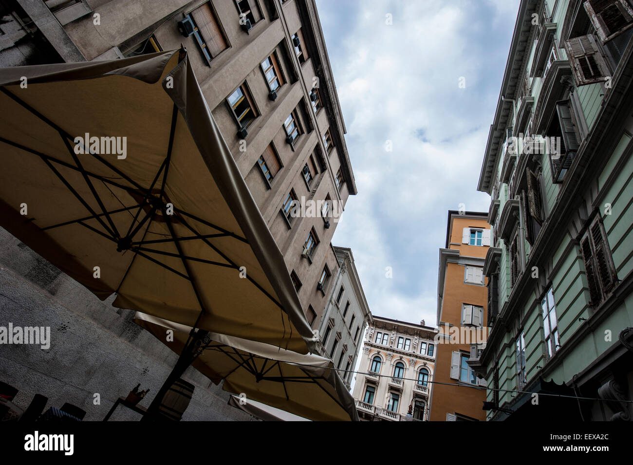 Narrow passage between town buildings in Trieste, Italy Stock Photo - Alamy