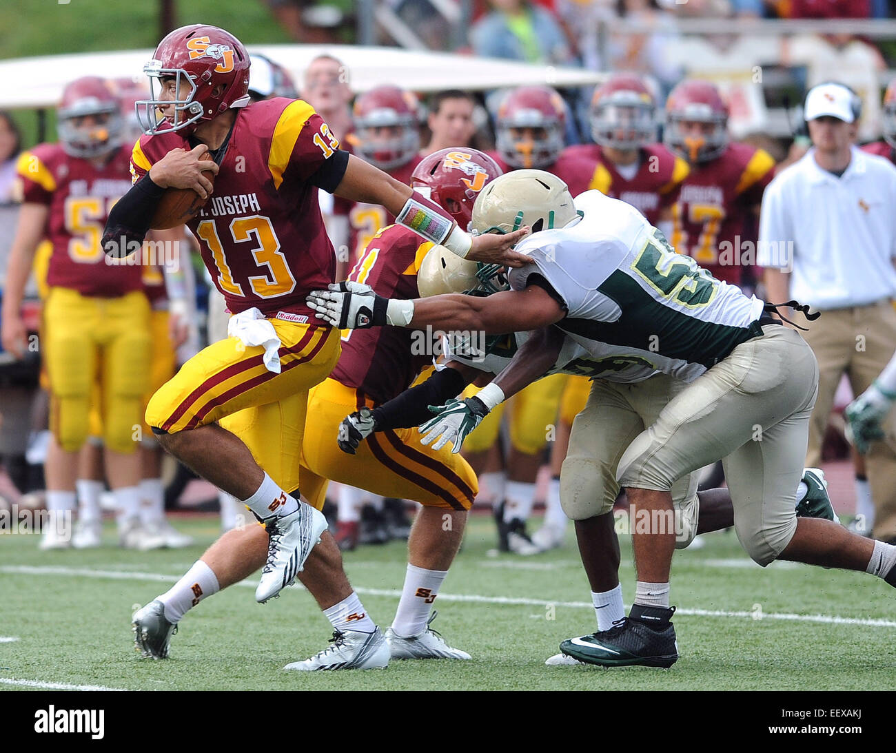 CT USA St. Joseph's QB Jordan Vazzano slips out of the pocket past ...