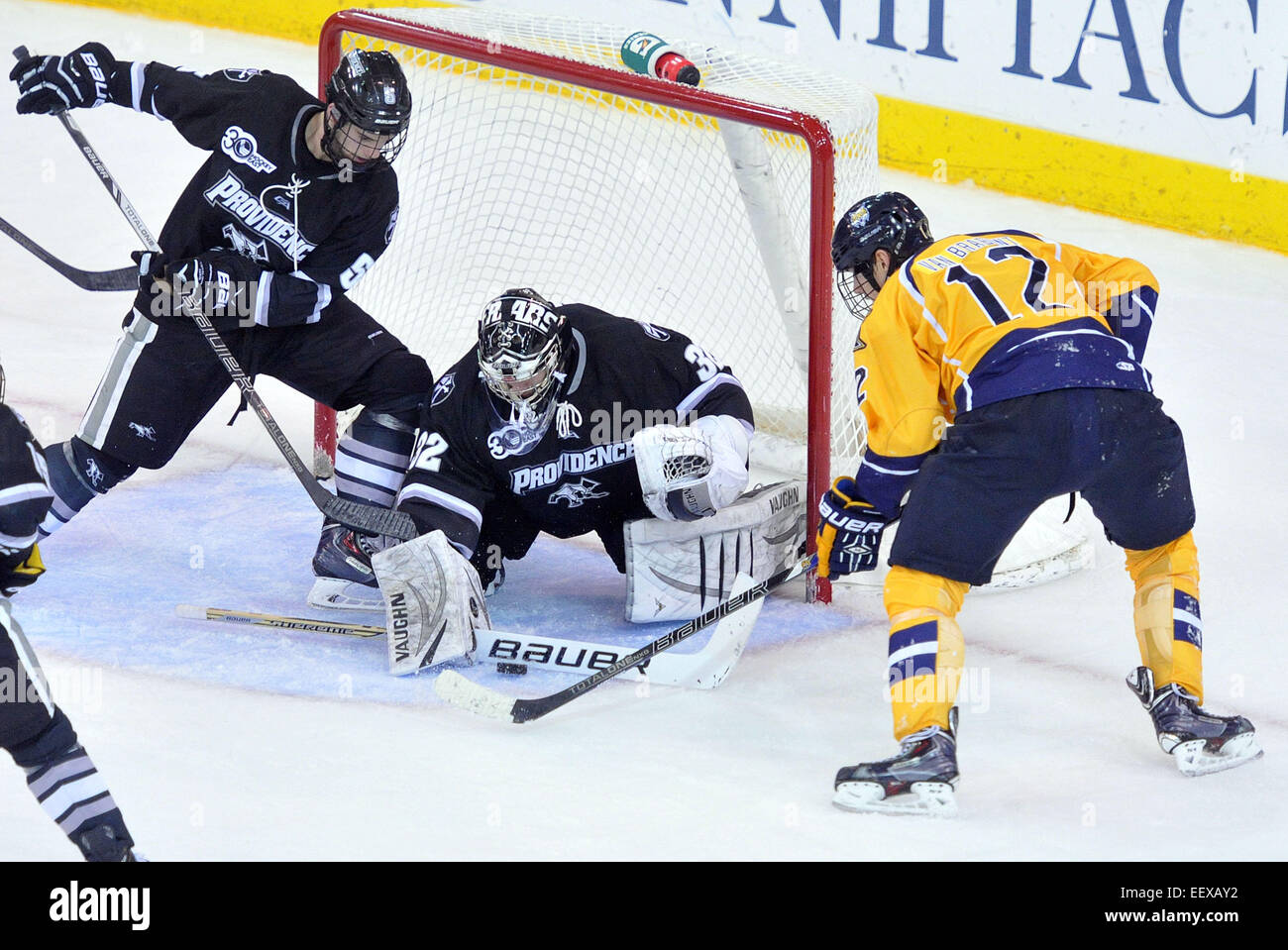 Providence's Goalie Jon Gillies makes the stop with help from Kyle ...