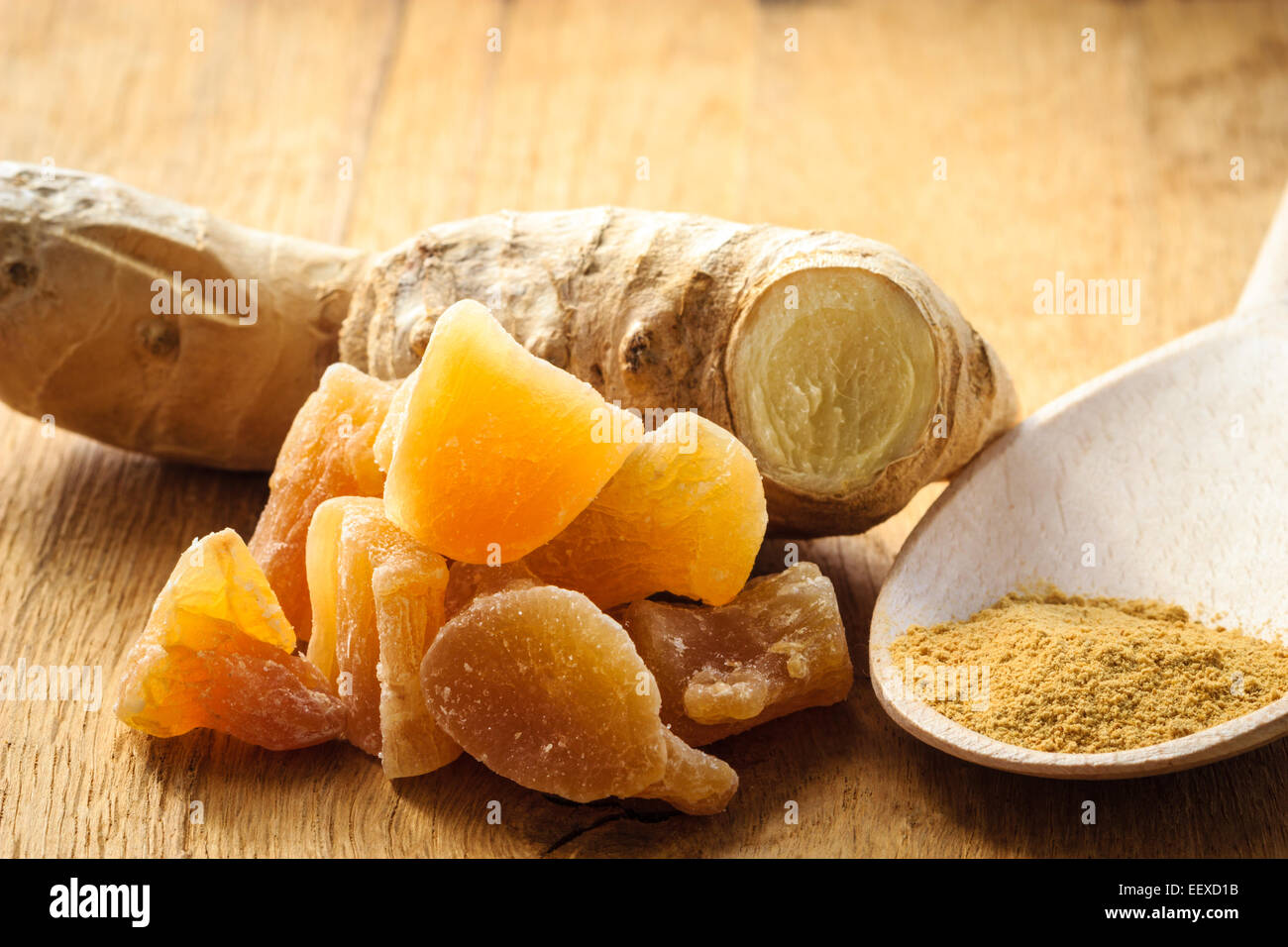 Three kinds of ginger - ground spice fresh and candied on rustic table ...