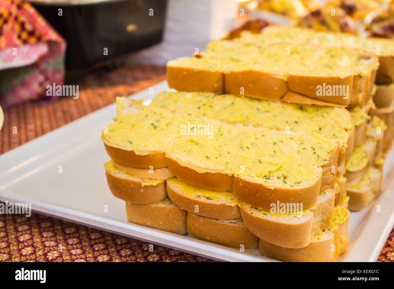 Buttered bread on the tray Stock Photo - Alamy