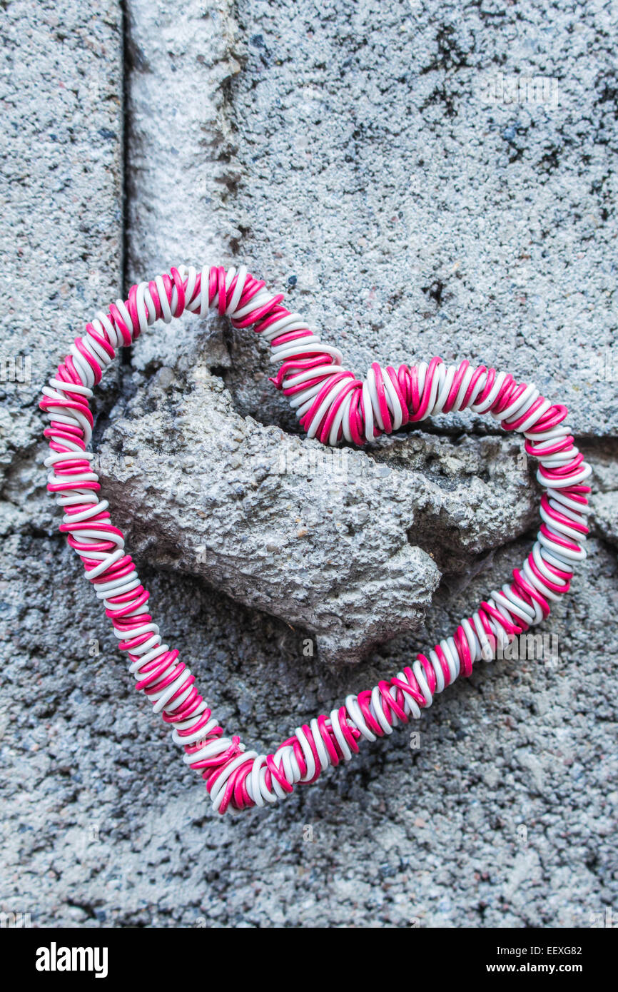 Heart on wall concrete inside the house Stock Photo - Alamy