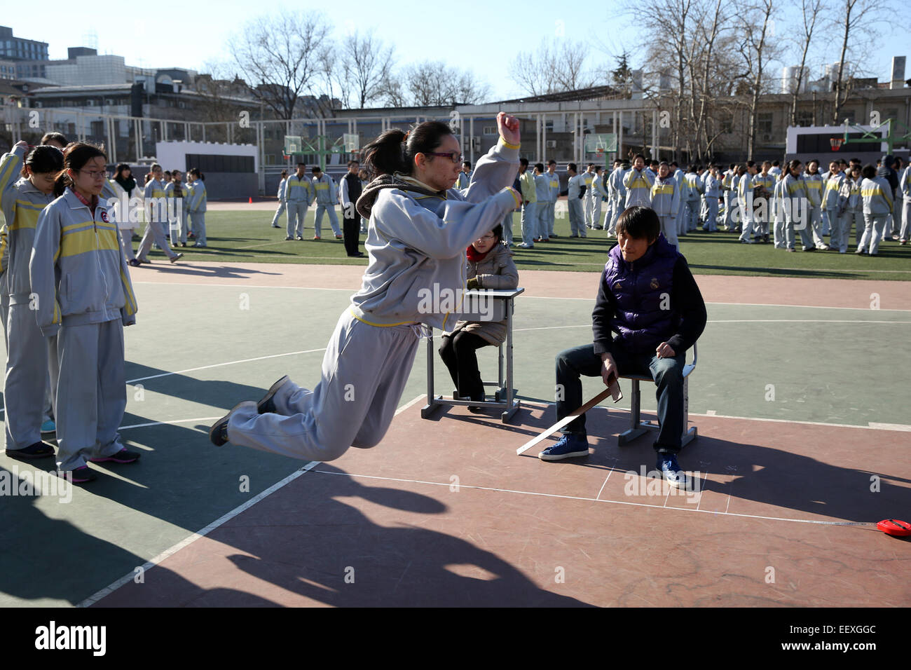 Beijing, China. 21st Jan, 2015. A student does the standing long jump ...