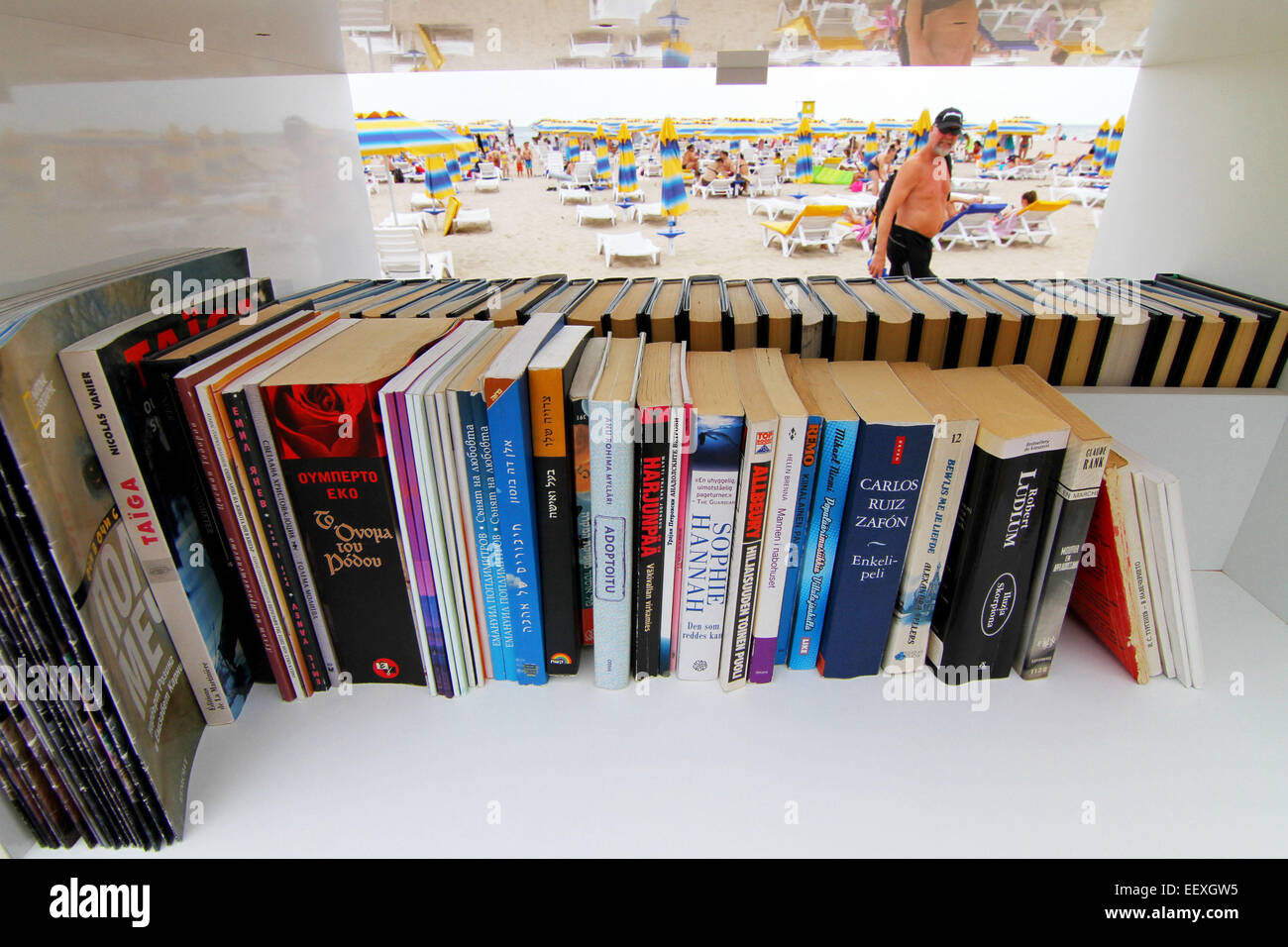 People look for and read books at the first ever free beach library ...