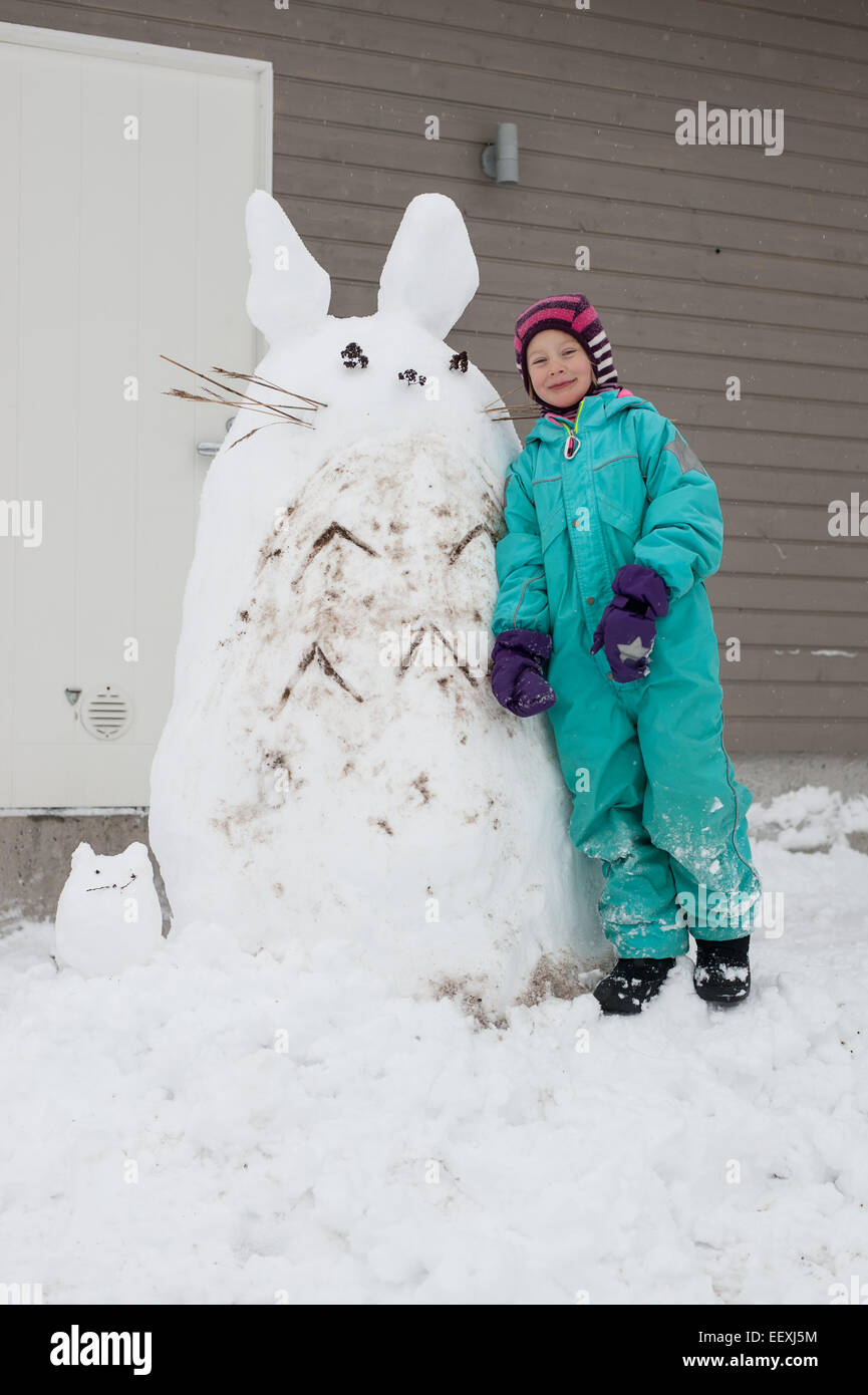 Child with a Totoro snowman and a little Totoro Stock Photo - Alamy